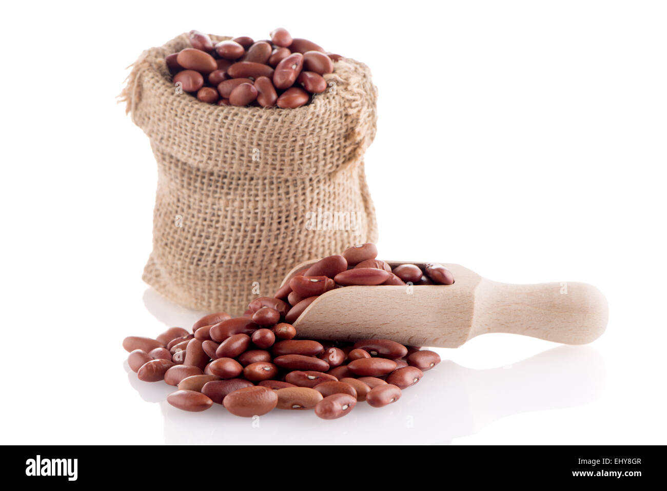 Red beans bag with wooden scoop on white background Stock Photo - Alamy