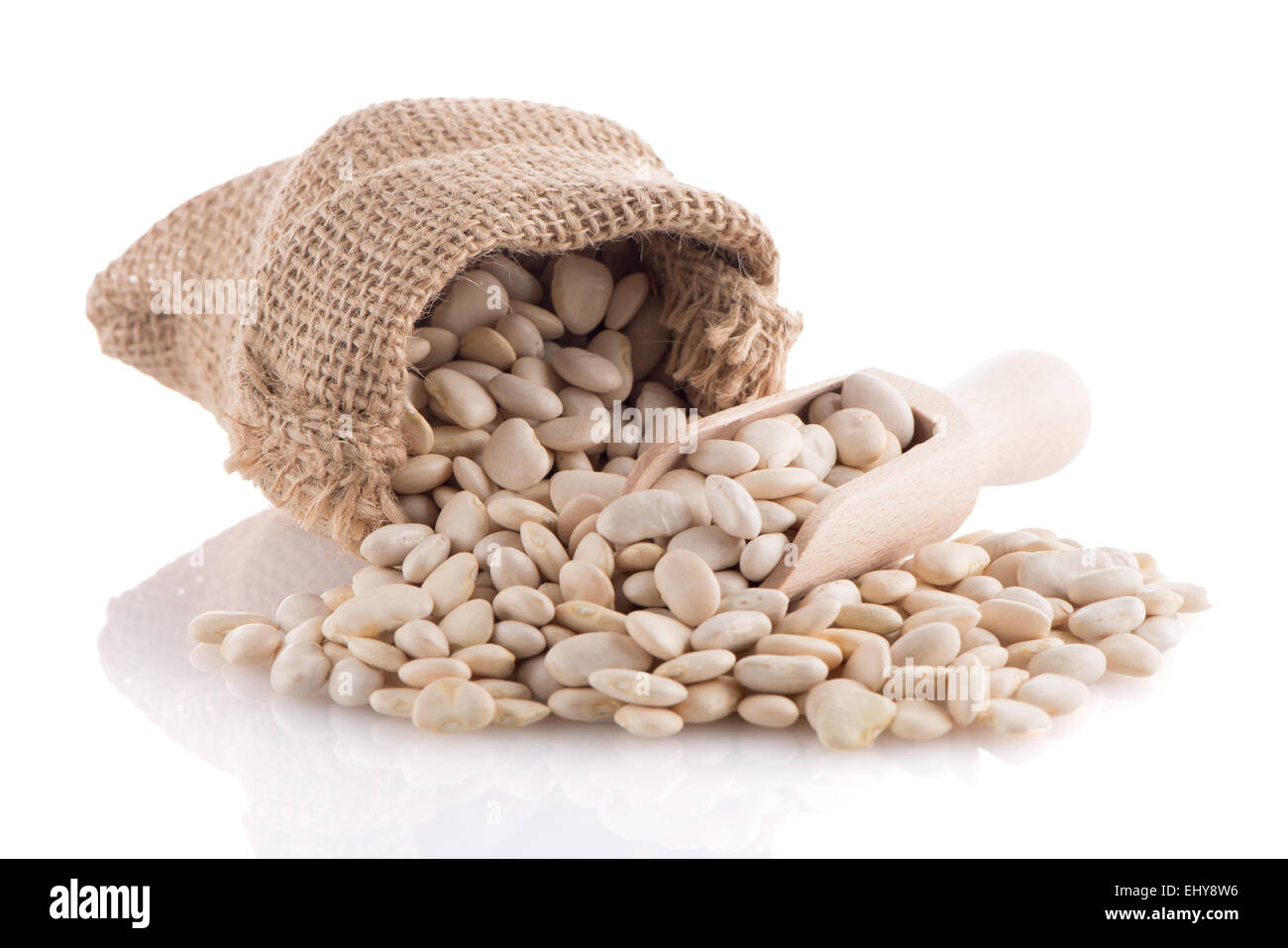 White beans bag with wooden scoop on white background Stock Photo - Alamy
