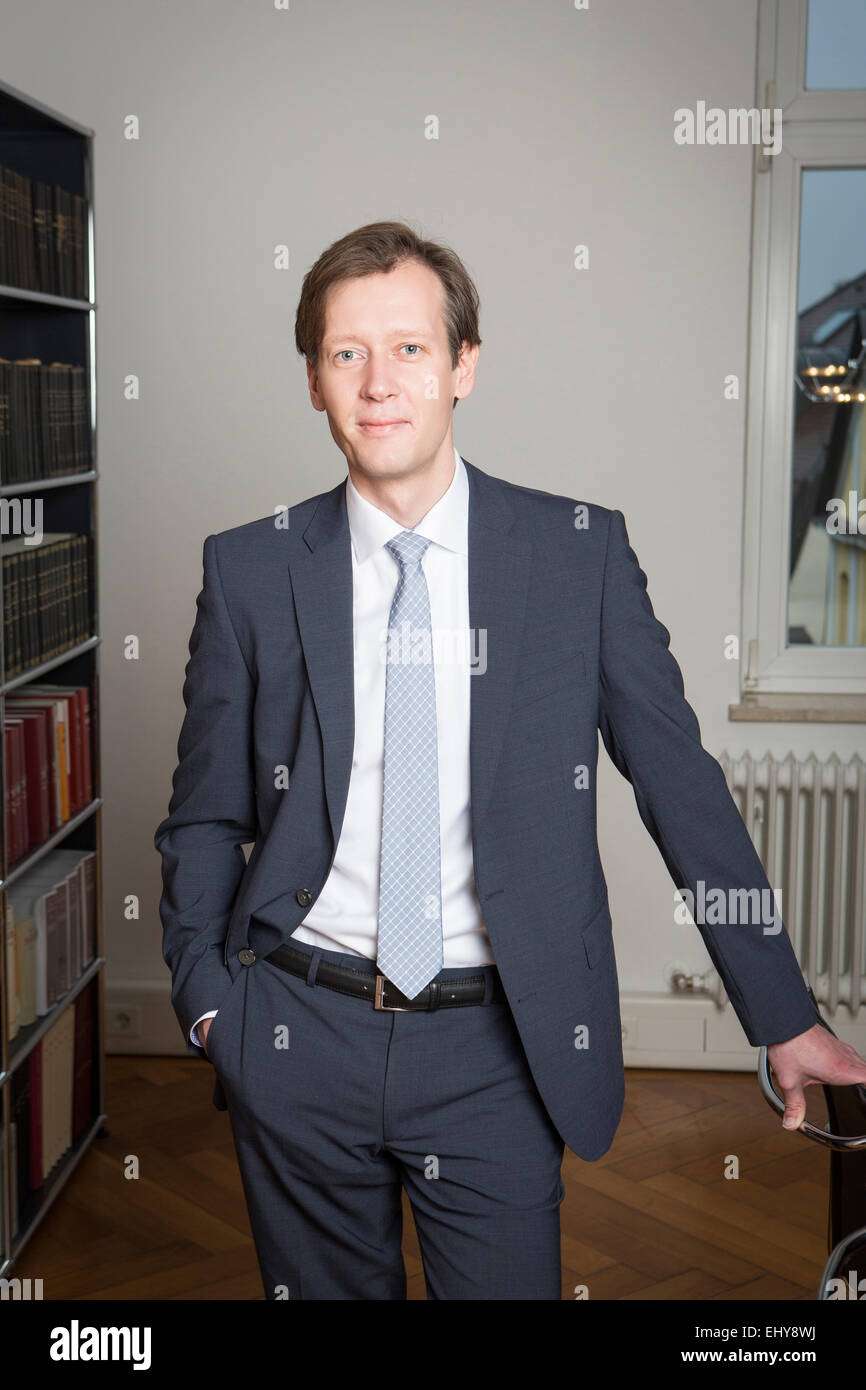 Lawyer standing in office Stock Photo - Alamy