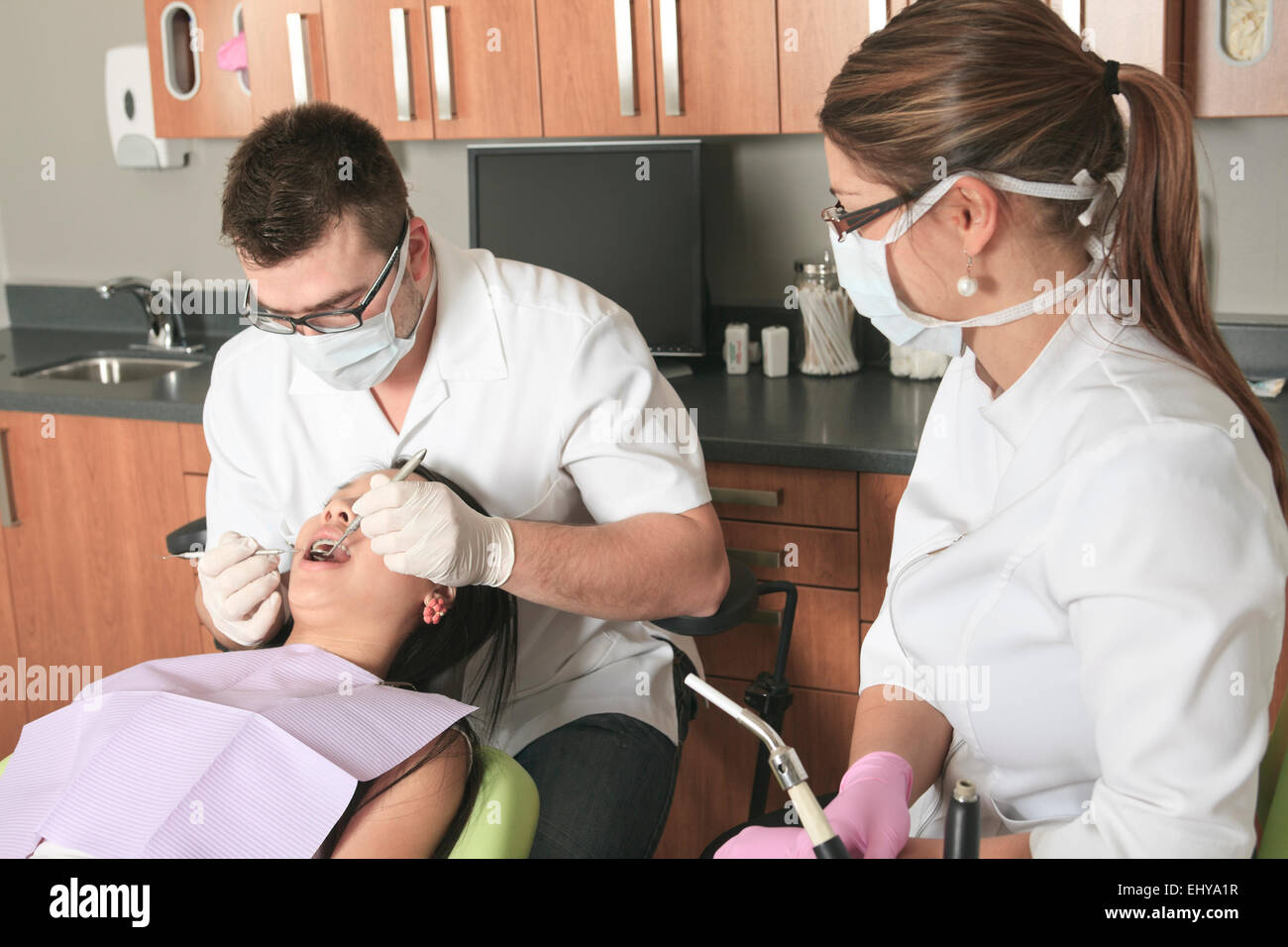 A dental office with employee and client Stock Photo - Alamy