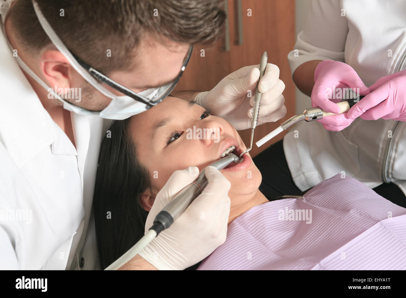 A dental office with employee and client Stock Photo - Alamy