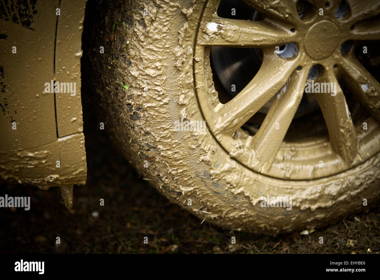 Color detail shot of an off-road car's wheel, covered in mud Stock ...