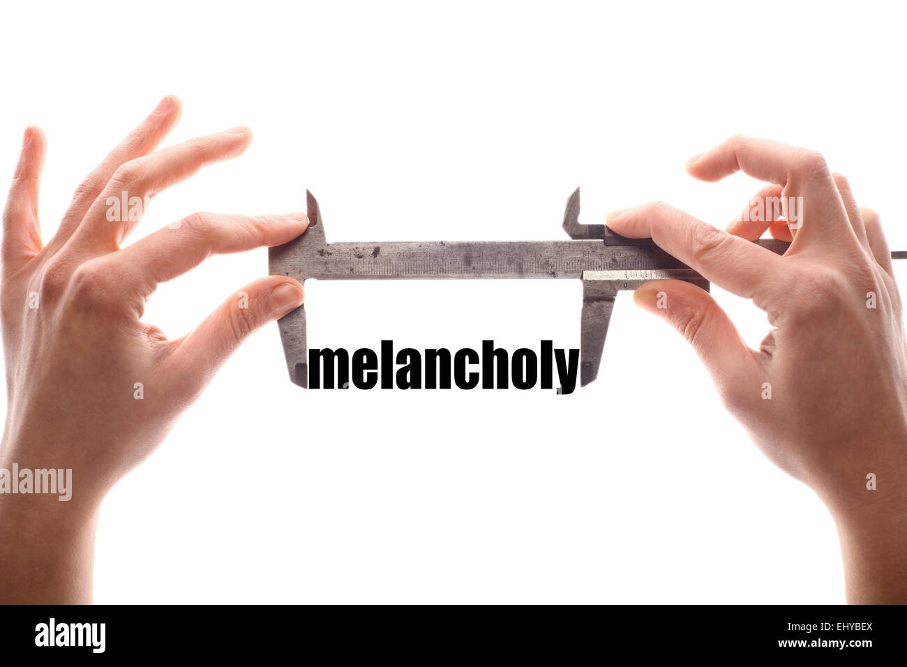 Color horizontal shot of two hands holding a caliper measuring the word ...