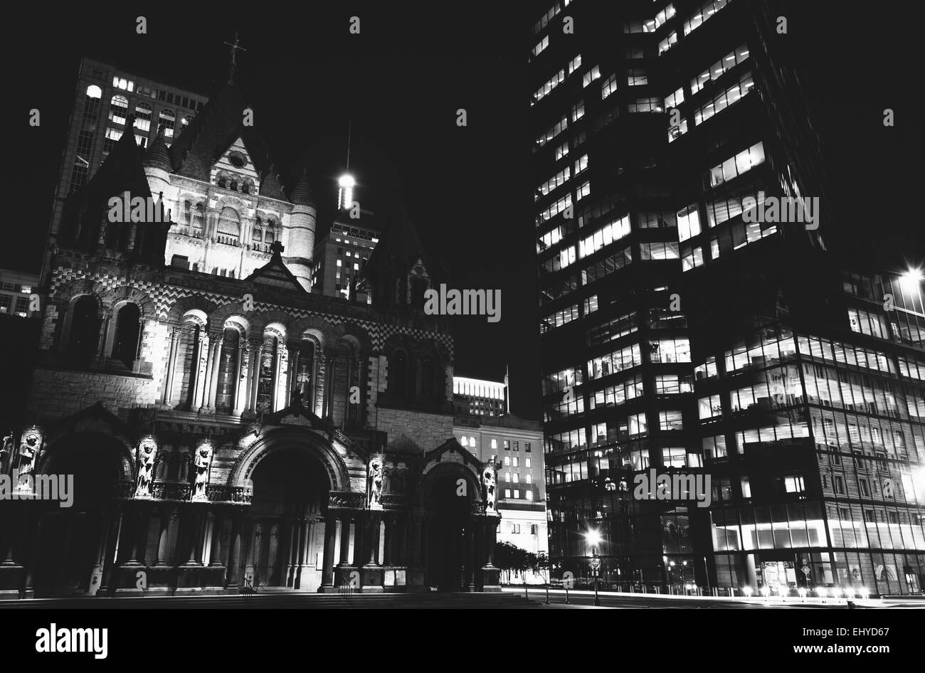 Trinity Church and the John Hancock Building at night, at Copley Square ...