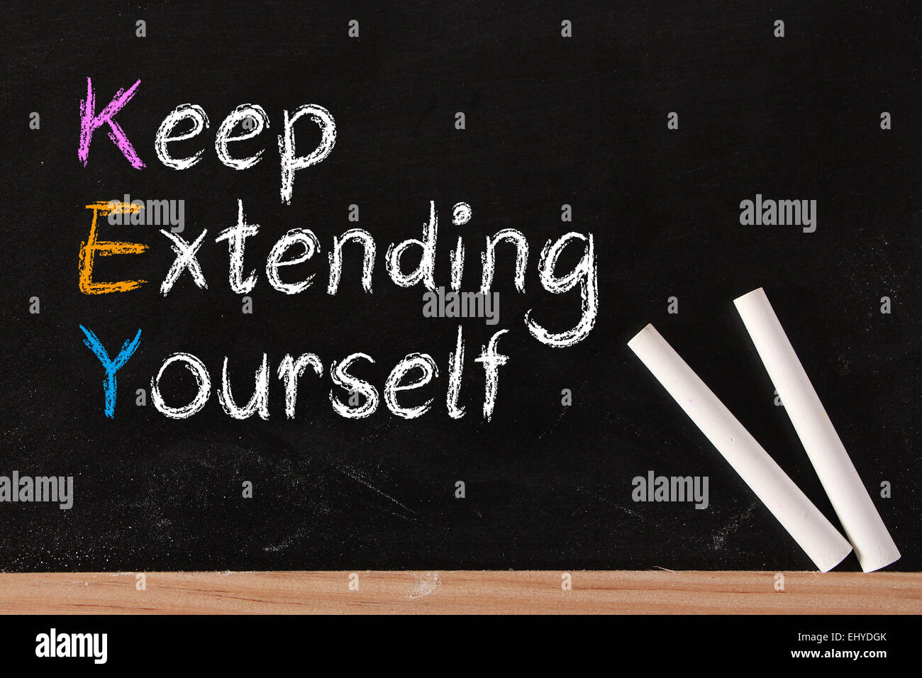 Keep Extending Yourself and KEY concept written on blackboard Stock ...