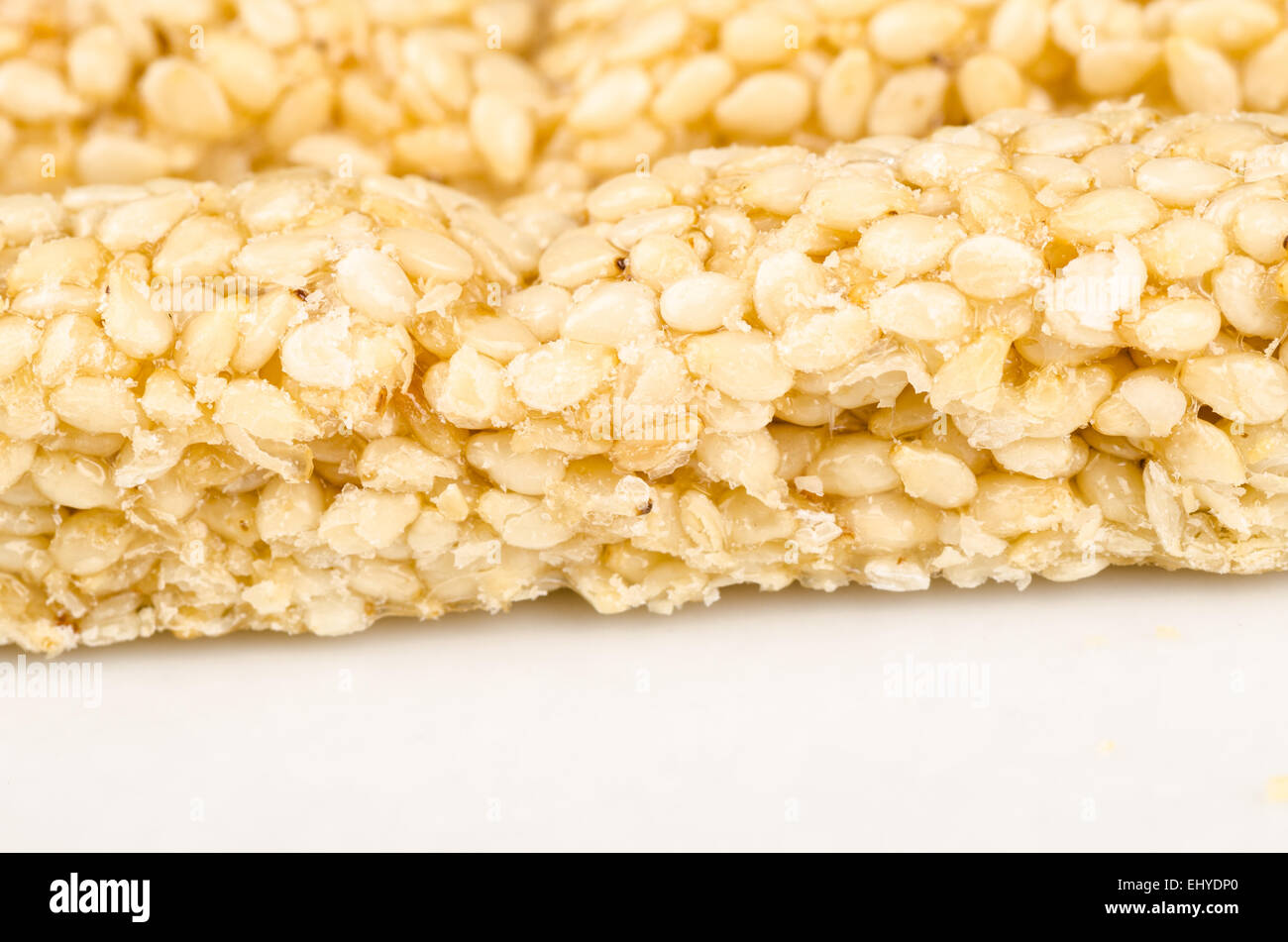 Closeup take of sesame bars isolated on white Stock Photo - Alamy