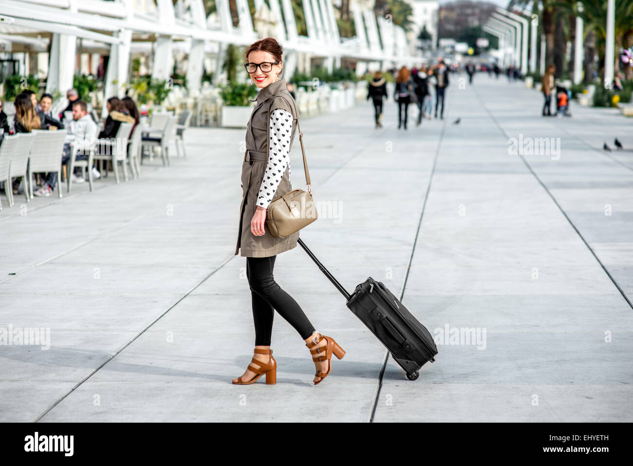Woman walk back bag hi-res stock photography and images - Alamy