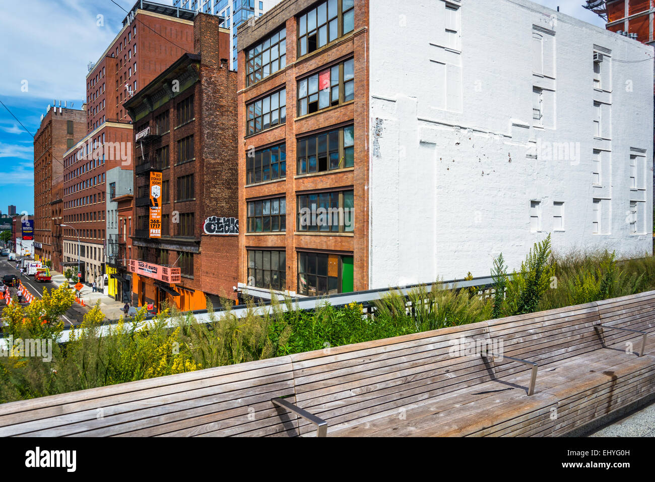 Bench and old buildings seen from The High Line, Manhattan, New York ...