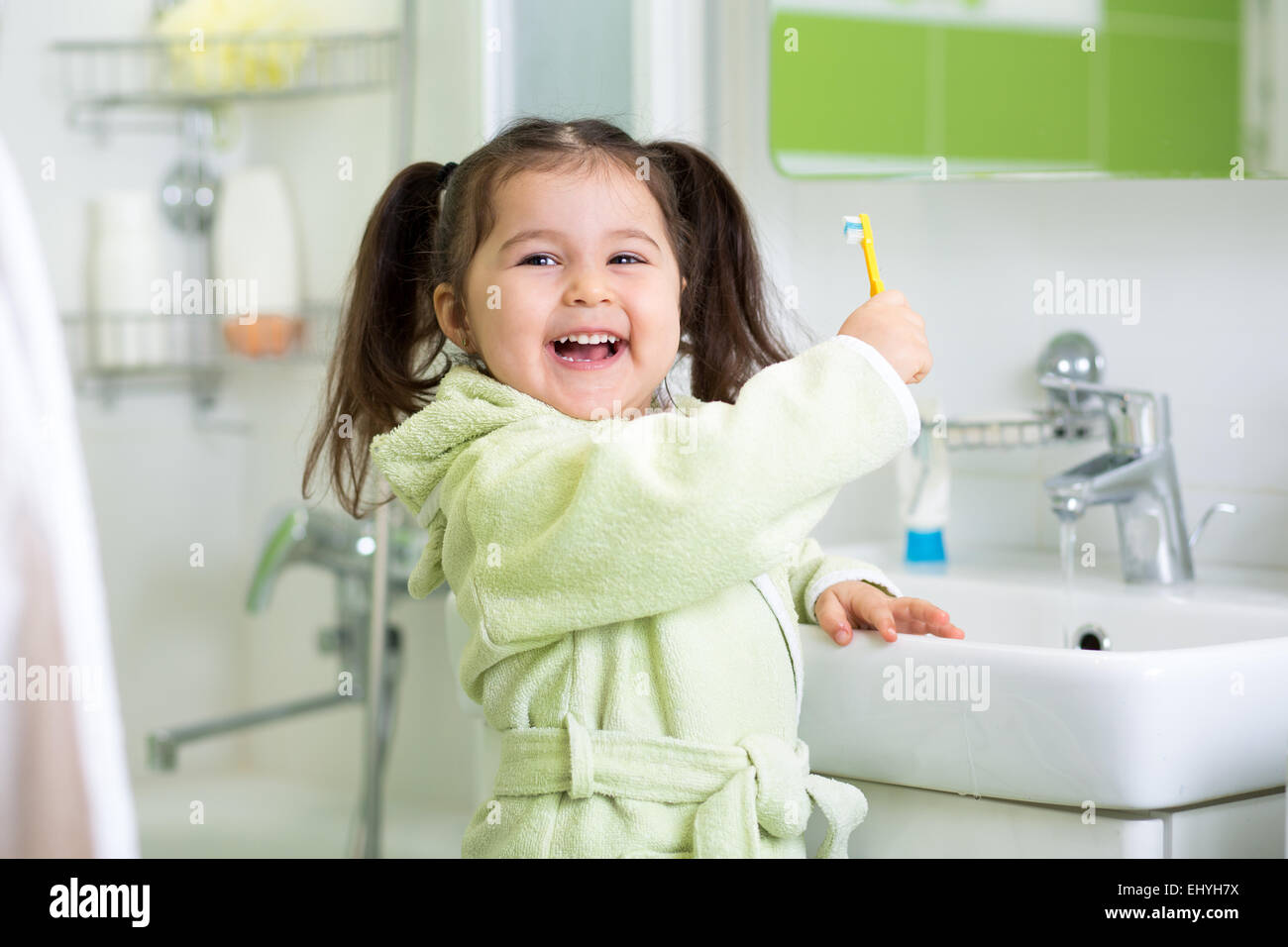 Child Brushing Teeth At Sink