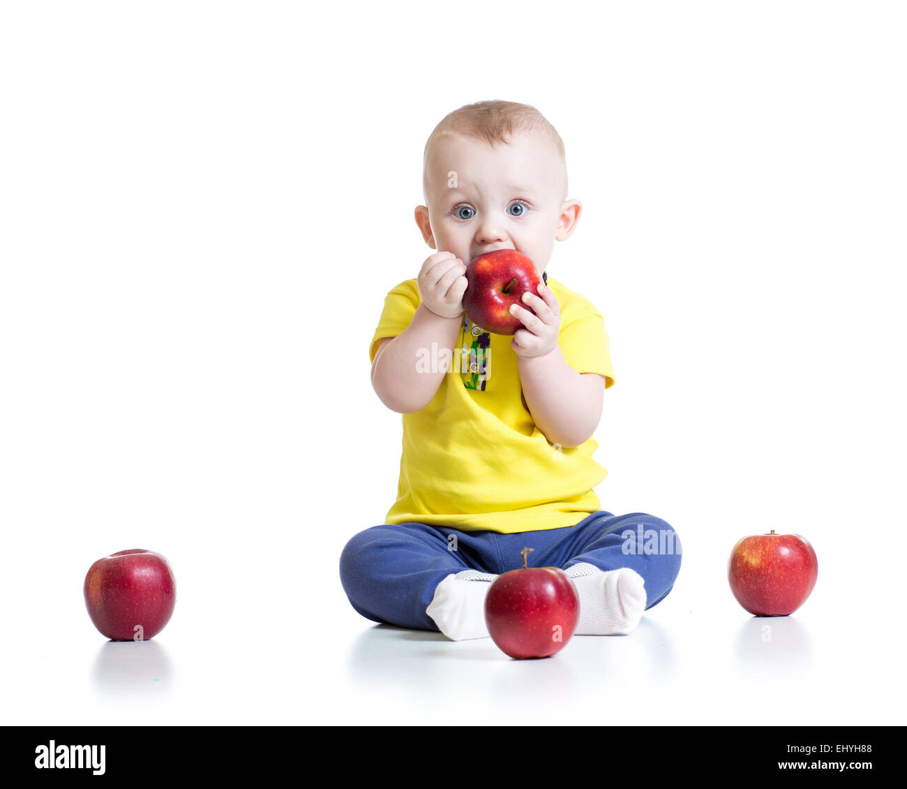 Kid boy eating apple, isolated on white Stock Photo - Alamy
