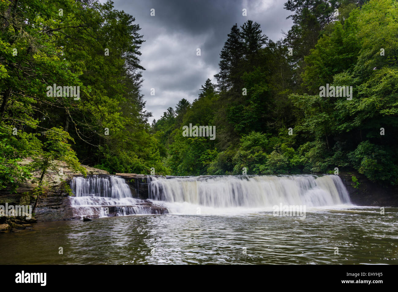 Dark clouds over Hooker Falls on the Little River in Dupont State ...