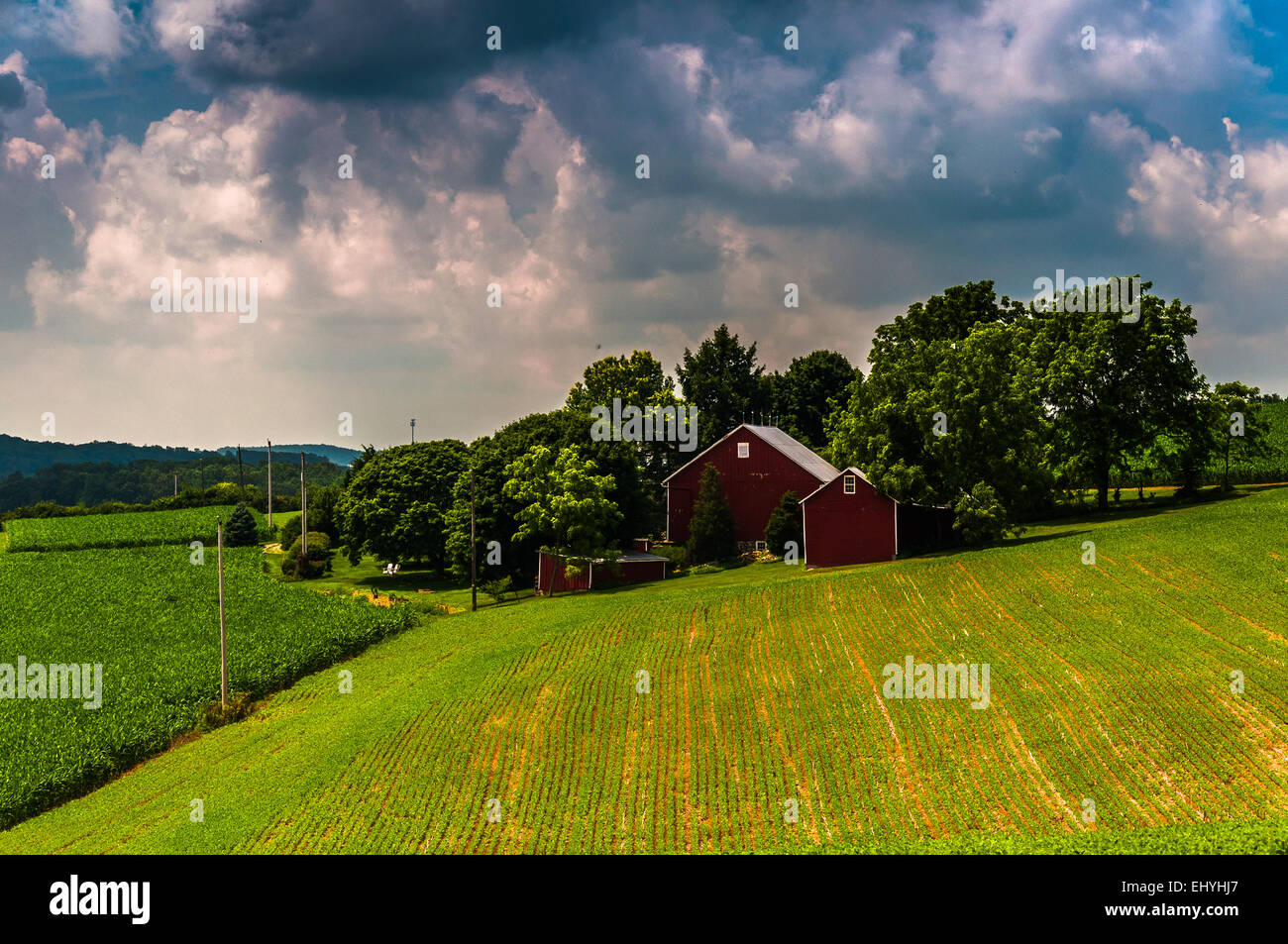 Dark clouds over a barn and farm fields in rural Southern York County ...