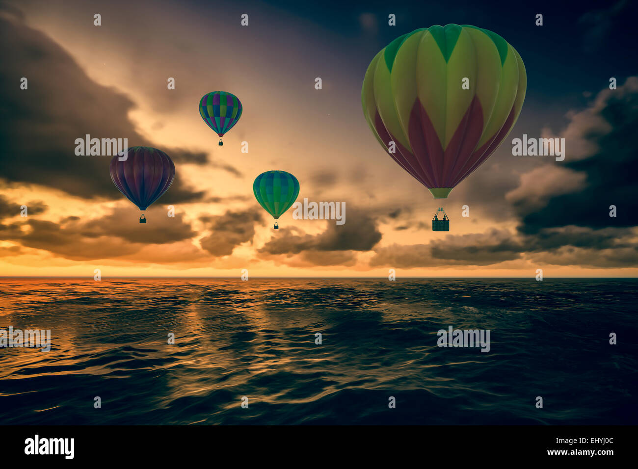Colorful Hot Air Balloons over sea on sunset Stock Photo - Alamy