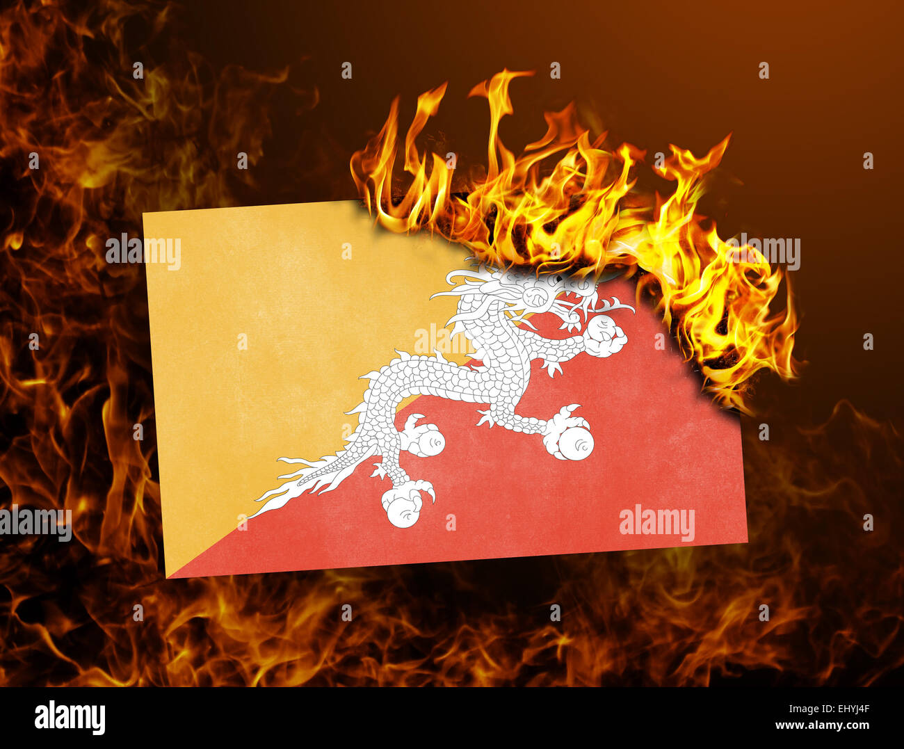 Flag burning - concept of war or crisis - Bhutan Stock Photo - Alamy