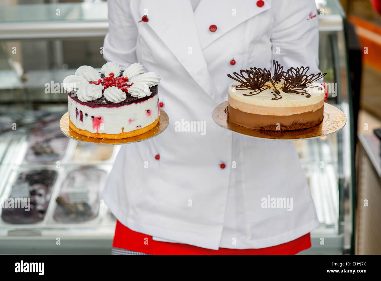 Chef holding cakes Stock Photo - Alamy