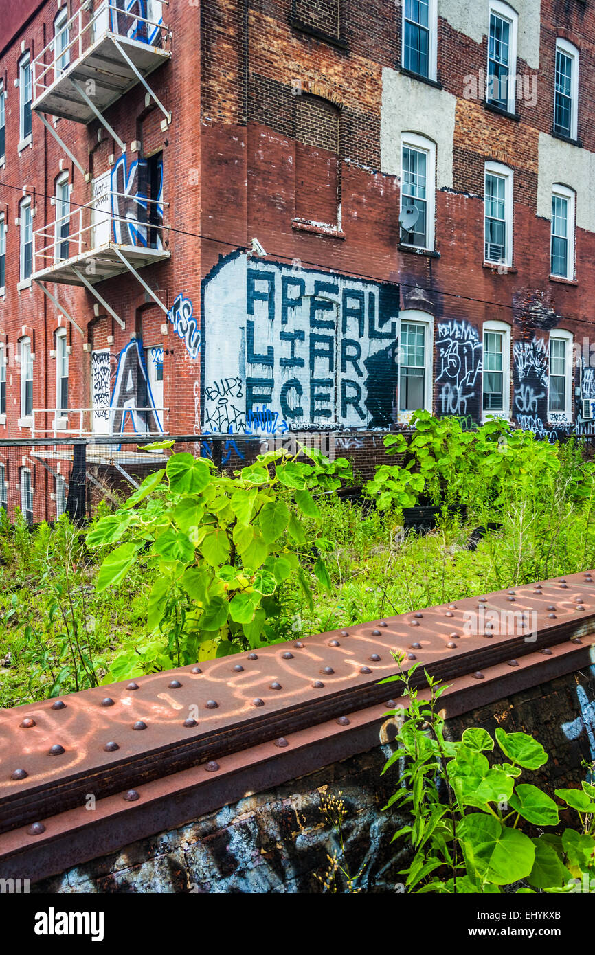 Graffiti on an old brick building, seen from the Reading Viaduct in ...