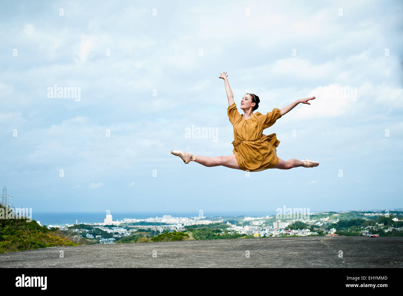 Ballerina leaping in the air on a roof hi-res stock photography and ...