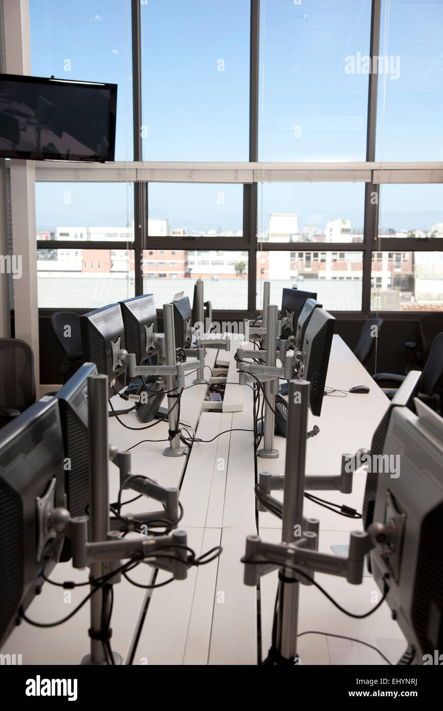 Rows of computers in an office Stock Photo - Alamy