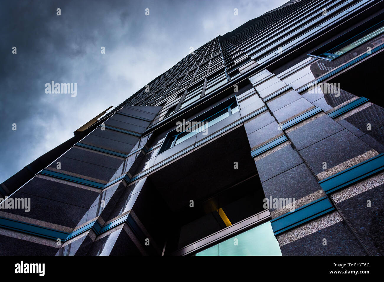 Looking up at a modern building under a cloudy sky in Philadelphia ...