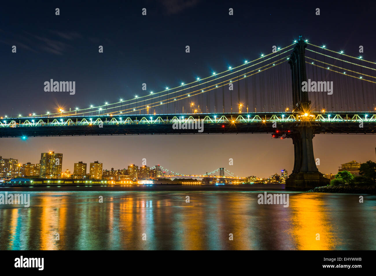 Manhattan Bridge at night, seen from Brooklyn Bridge Park, in Brooklyn ...