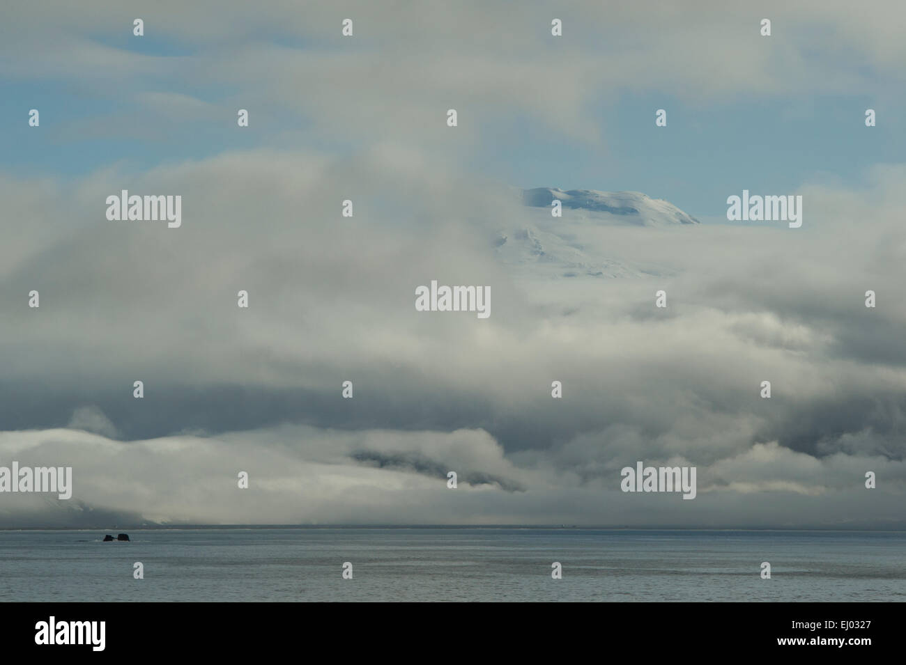 The Beerenberg Volcano on Jan Mayen surround by cloud with only the ...
