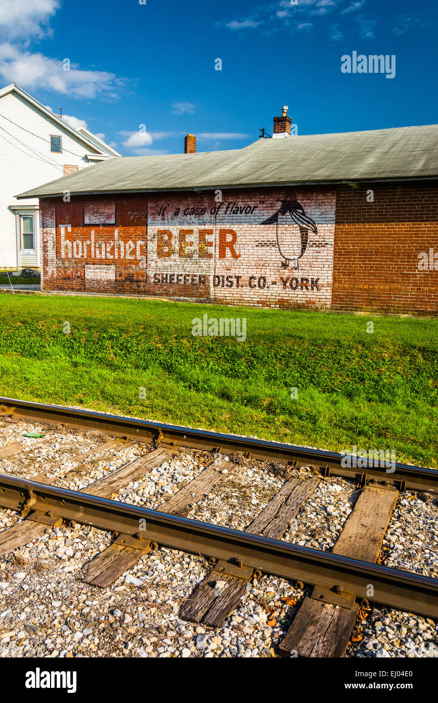 Railroad tracks and a brick building in Thomasville, Pennsylvania Stock ...