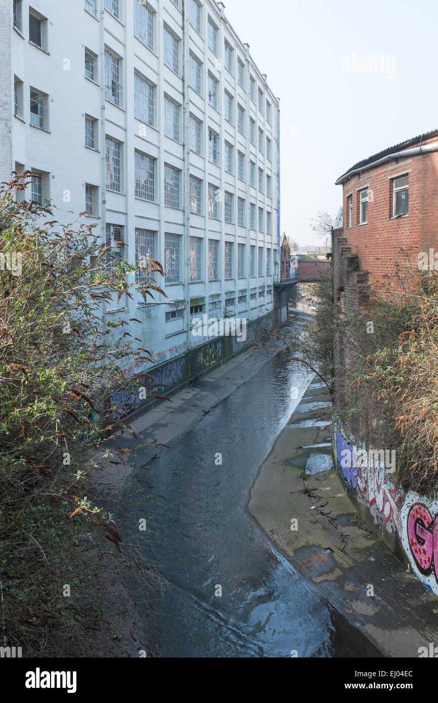 The River Rea flowing past buildings in the Custard Factory in Digbeth ...