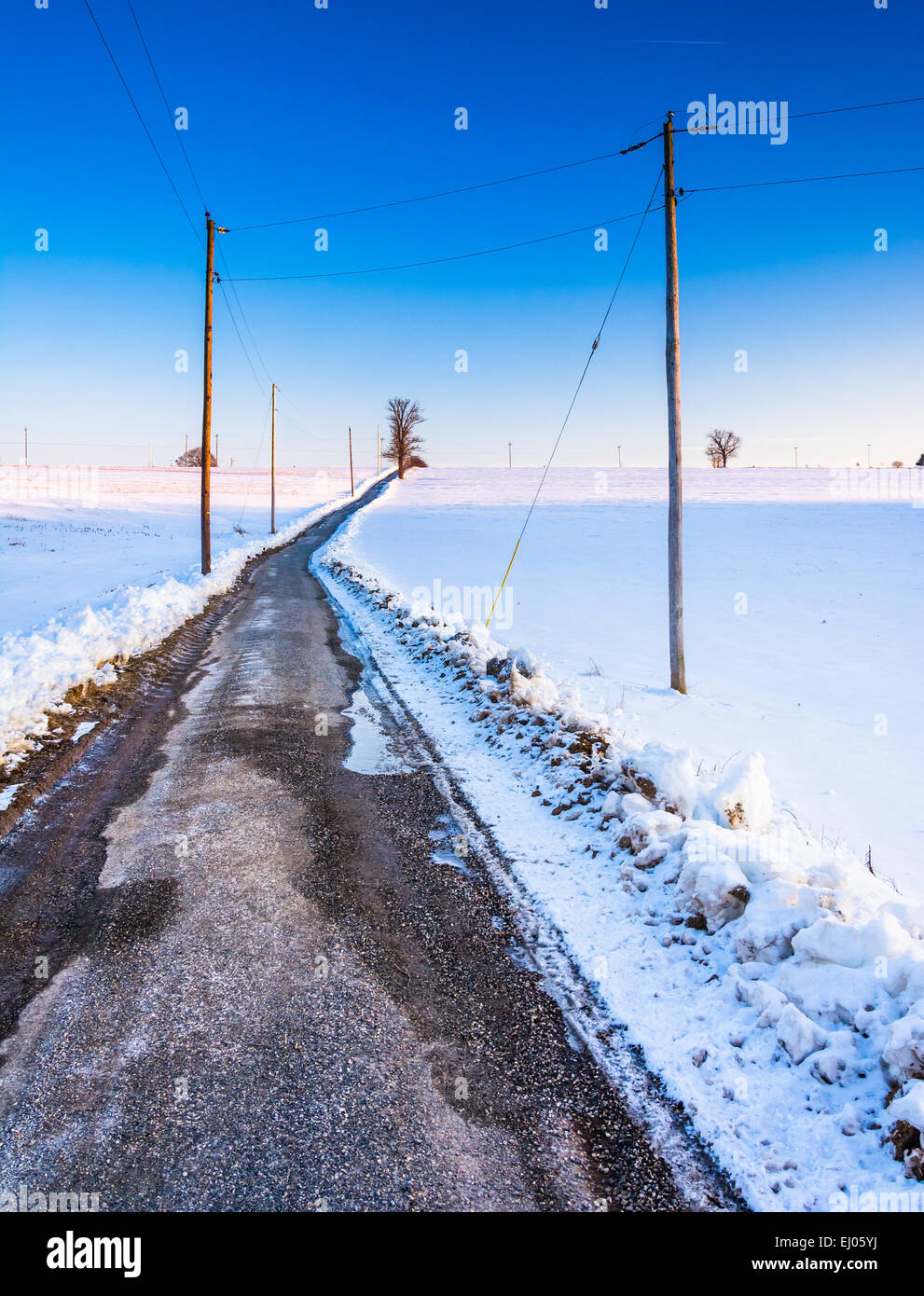 Road through snow covered farm fields in eastern York County ...