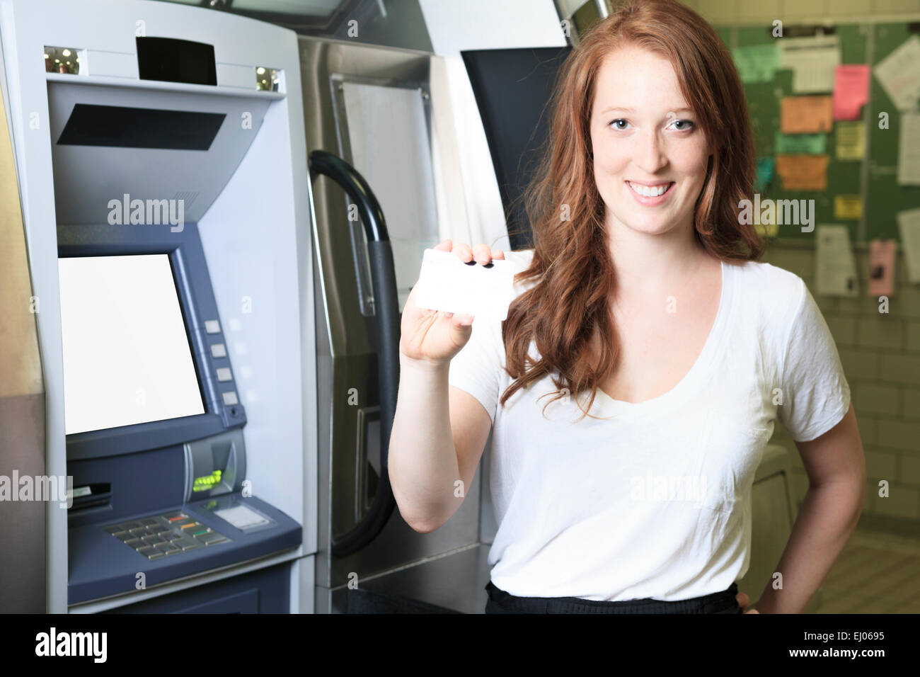 A student using a ATM machine at school Stock Photo - Alamy