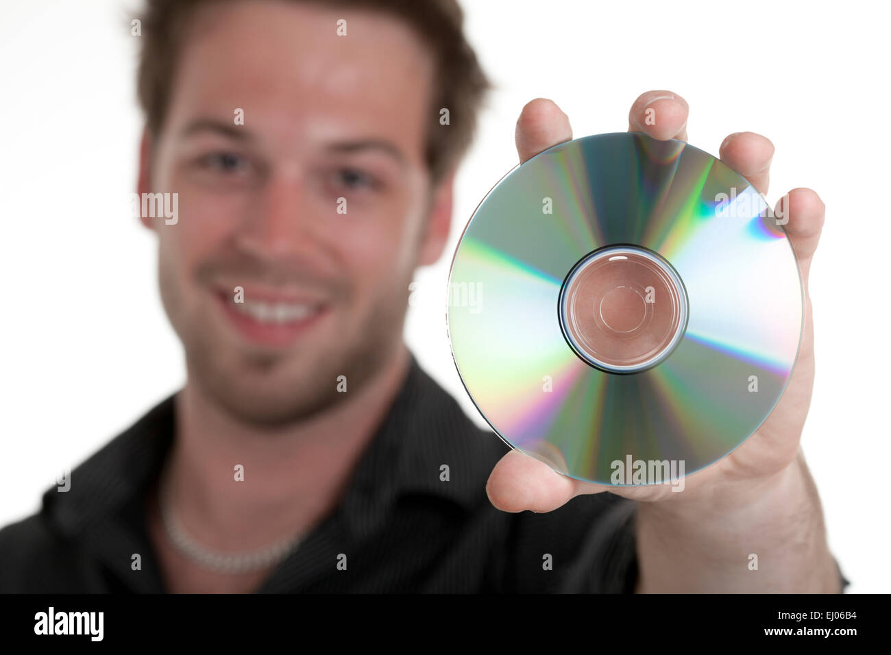 A 30 years old men holding a cd or a dvd Stock Photo - Alamy