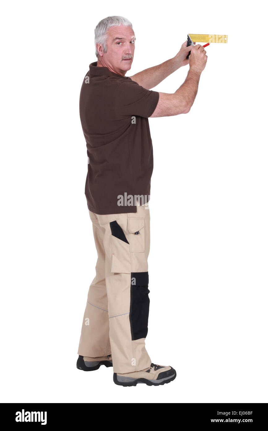 Man marking on a wall Stock Photo - Alamy