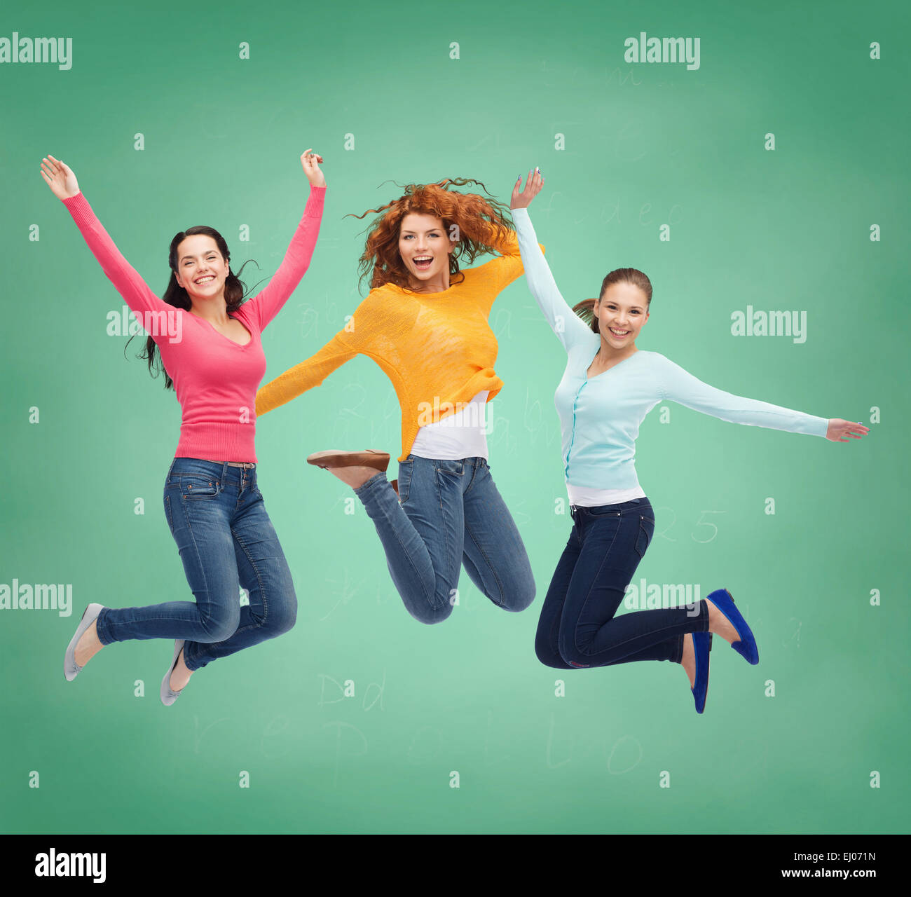 smiling young women jumping in air Stock Photo - Alamy