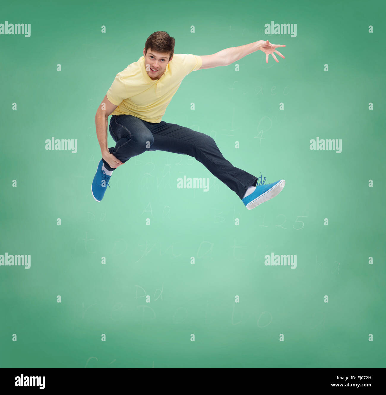 smiling young man jumping in air Stock Photo - Alamy