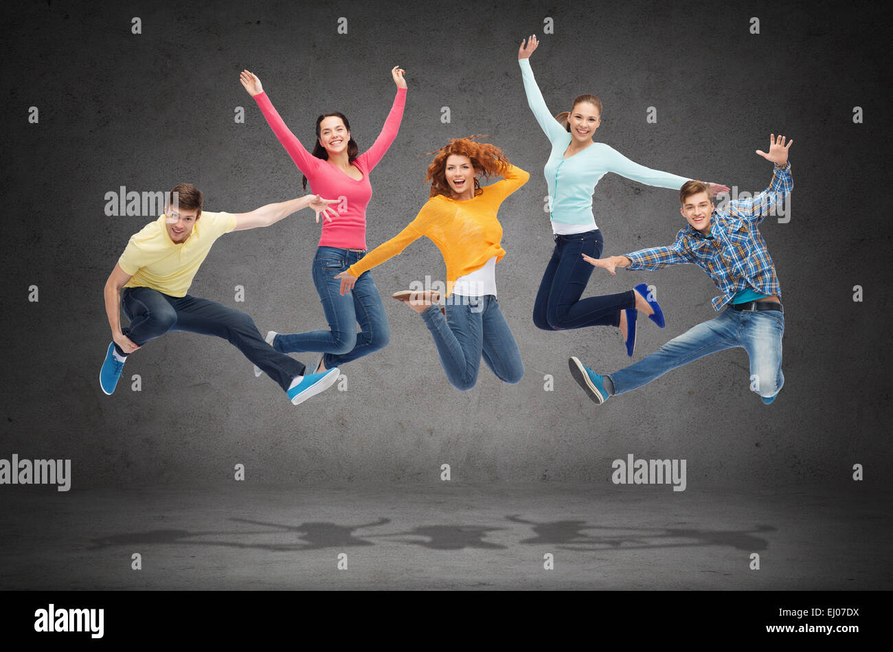 group of smiling teenagers jumping in air Stock Photo - Alamy