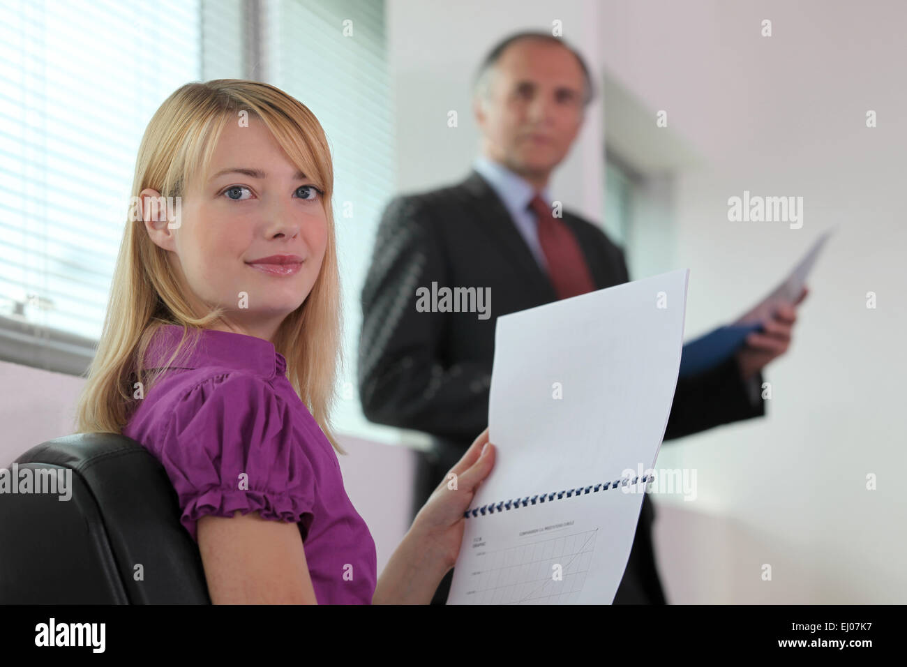 Secretary processing paperwork Stock Photo - Alamy
