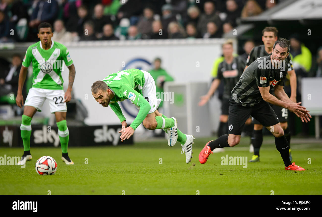 Wolfsburg, Germany. 15th Mar, 2015. Wolfsburg's Bas Dost (C) and ...