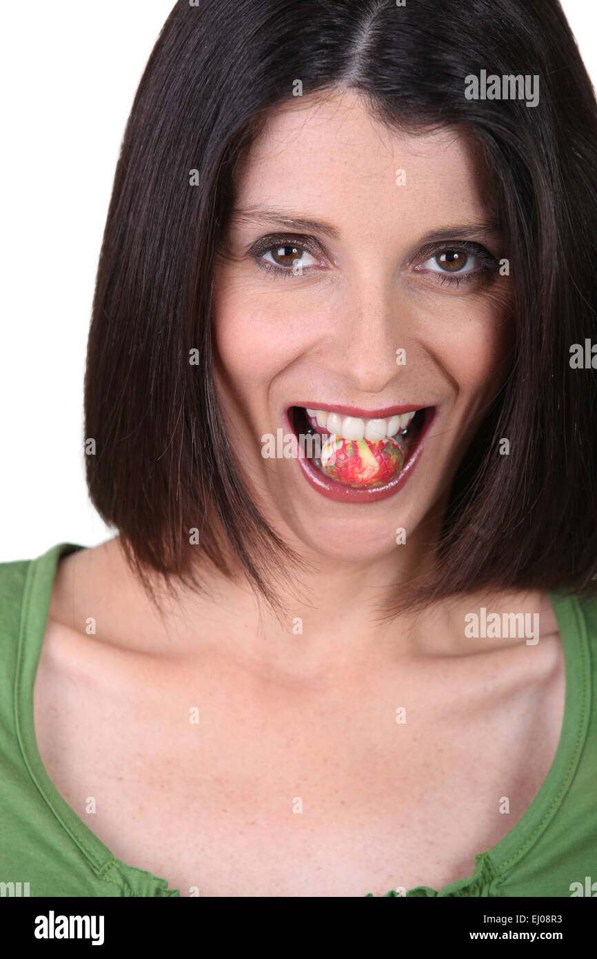 Woman eating candy Stock Photo - Alamy