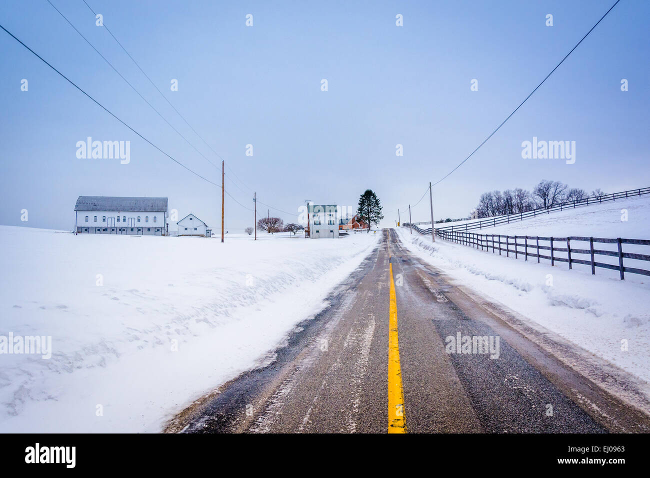 Snow covered farm along a country road in rural York County ...