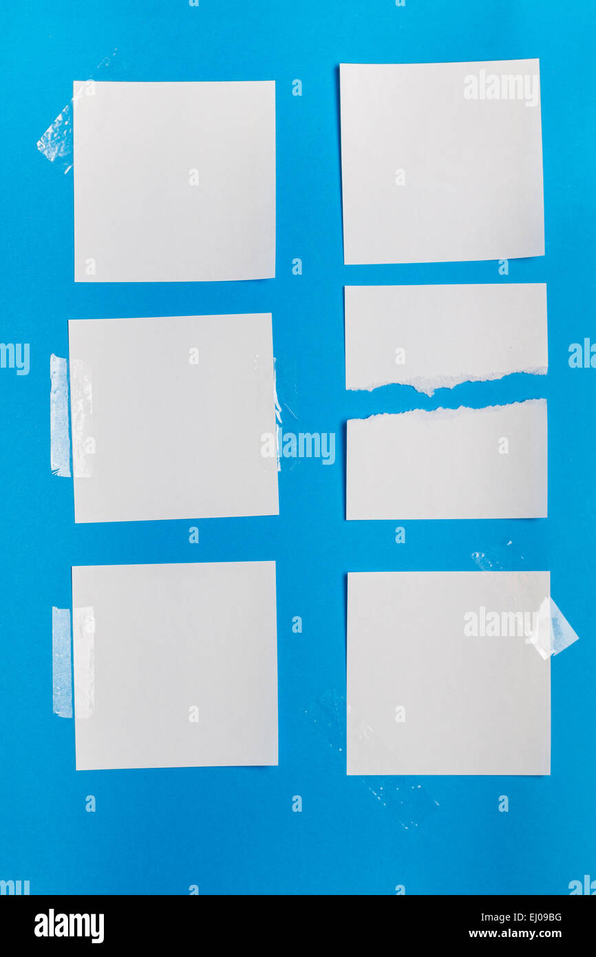Several paper notes with sticky tape on a blue background Stock Photo ...