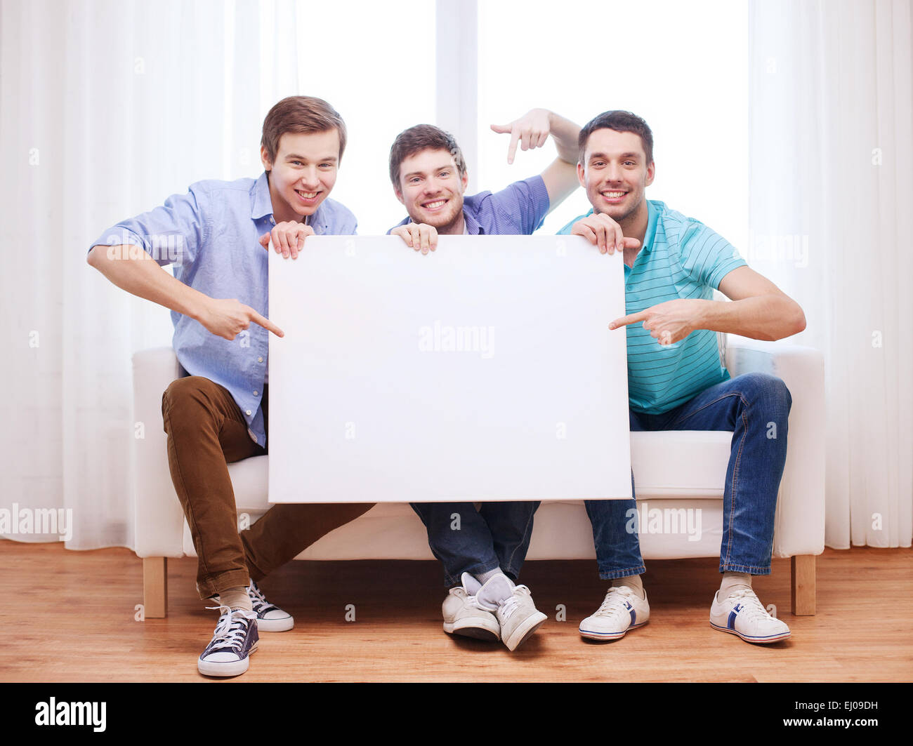Group of young friends holding blank hi-res stock photography and ...