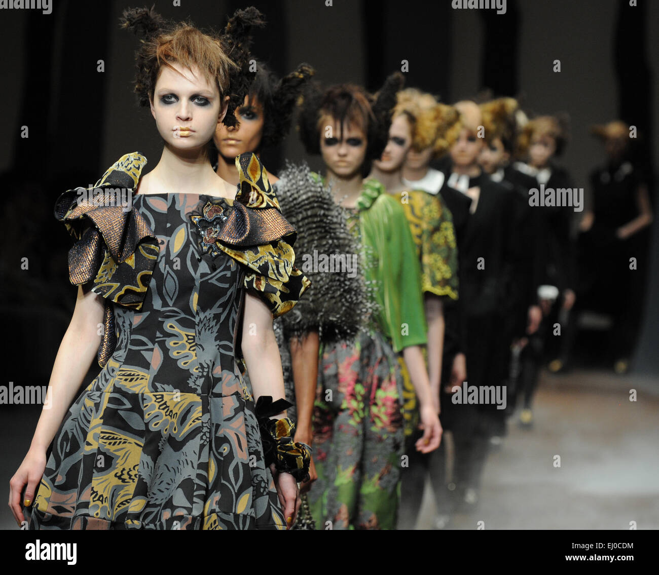 Tokyo, Japan. 19th Mar, 2015. Models display creations designed by ...