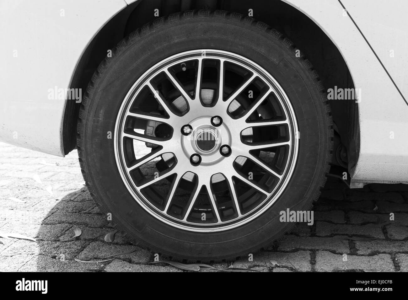 White modern car fragment with wheel on steel disc, closeup photo Stock ...