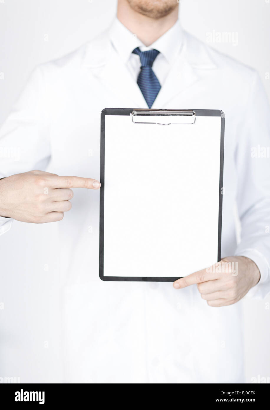 doctor pointing at blank white paper Stock Photo - Alamy