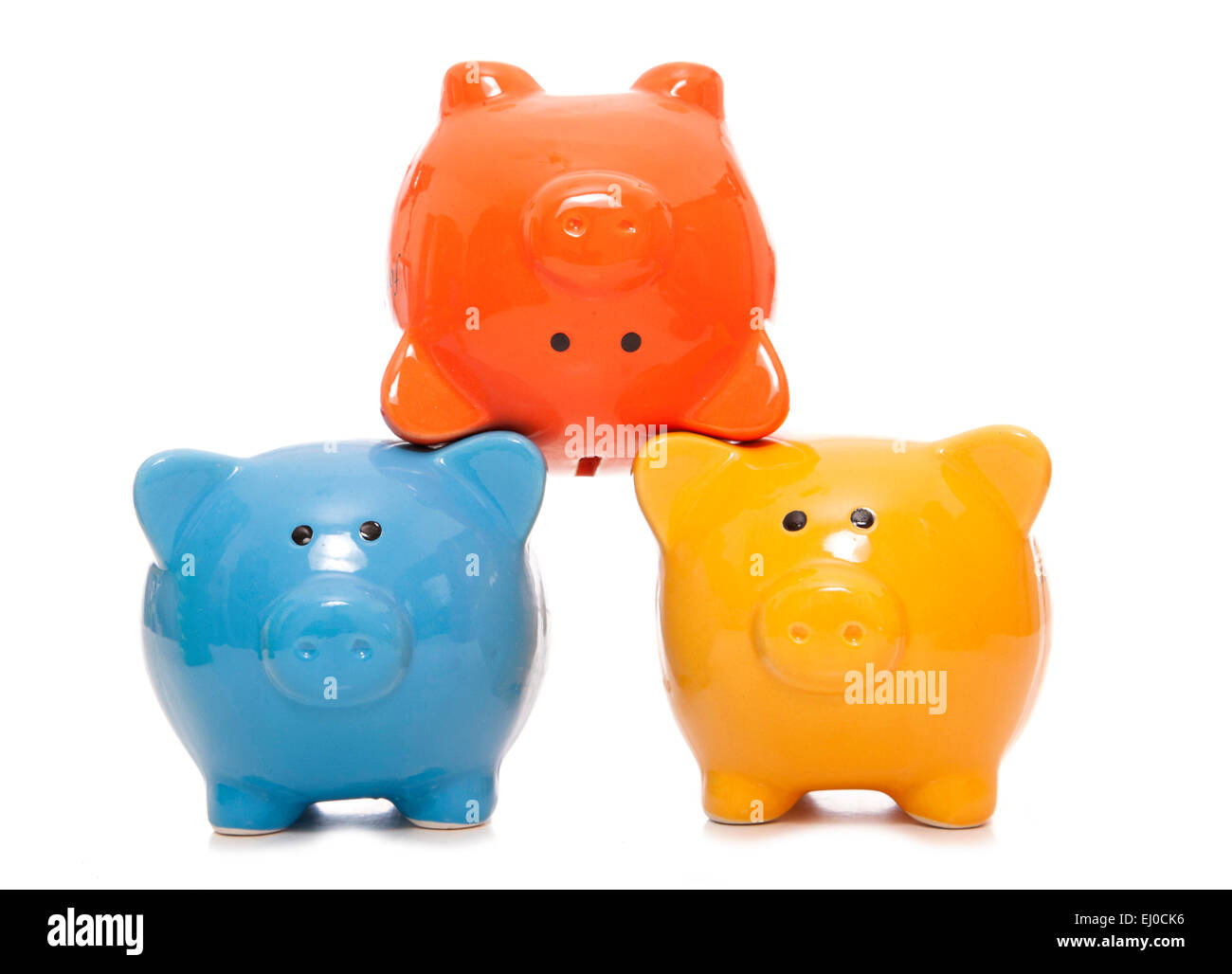 three piggy banks studio cutout Stock Photo - Alamy
