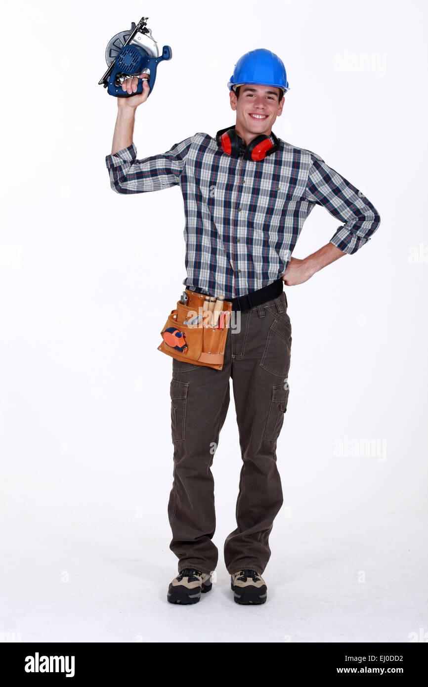 Construction worker using circular saw Stock Photo - Alamy