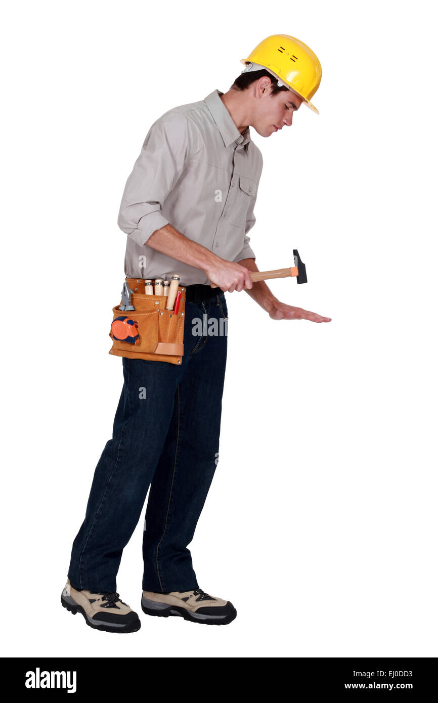 Carpenter holding hammer Stock Photo - Alamy