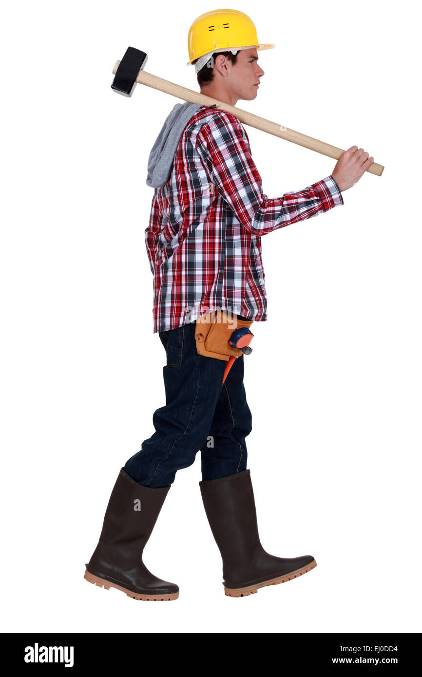 Man carrying sledge-hammer Stock Photo - Alamy Man carrying sledge-hammer Stock Photo - Alamy