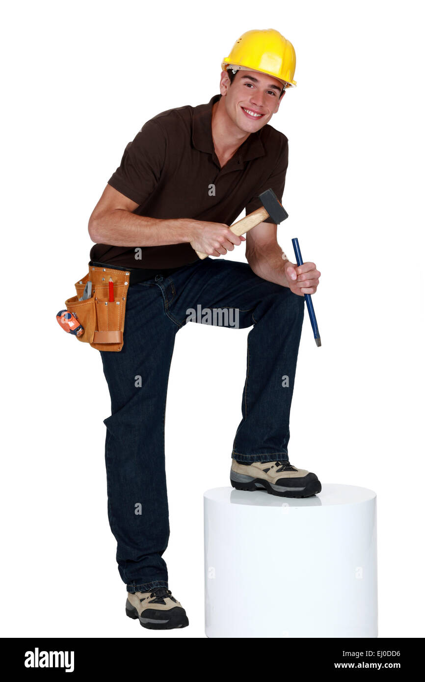 Man with a hammer and chisel Stock Photo - Alamy