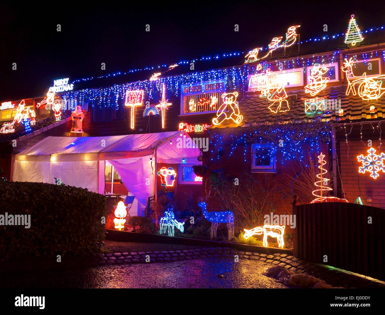 Street with Christmas lights on the all houses Stock Photo - Alamy