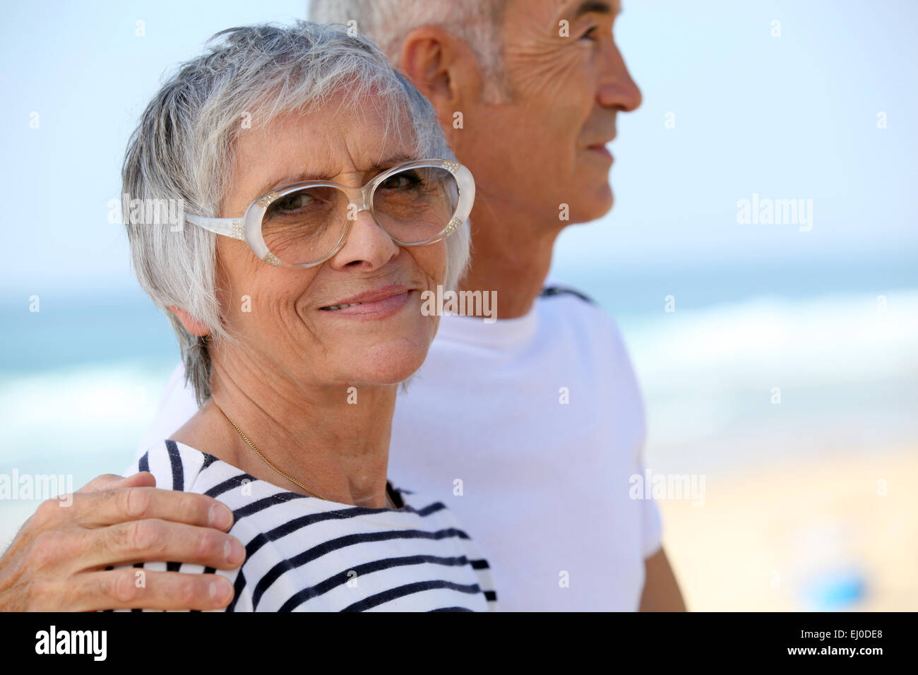 Mature couple embracing Stock Photo - Alamy